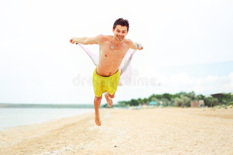 Flying Guy Having Fun on the Beach and Having a Good Time Stock Photo ...
