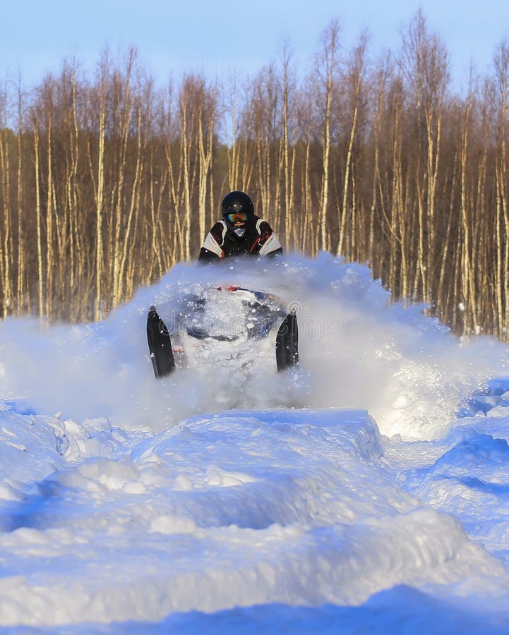 Moving Snowmobile in Winter Forest in the Mountains Editorial Photo ...