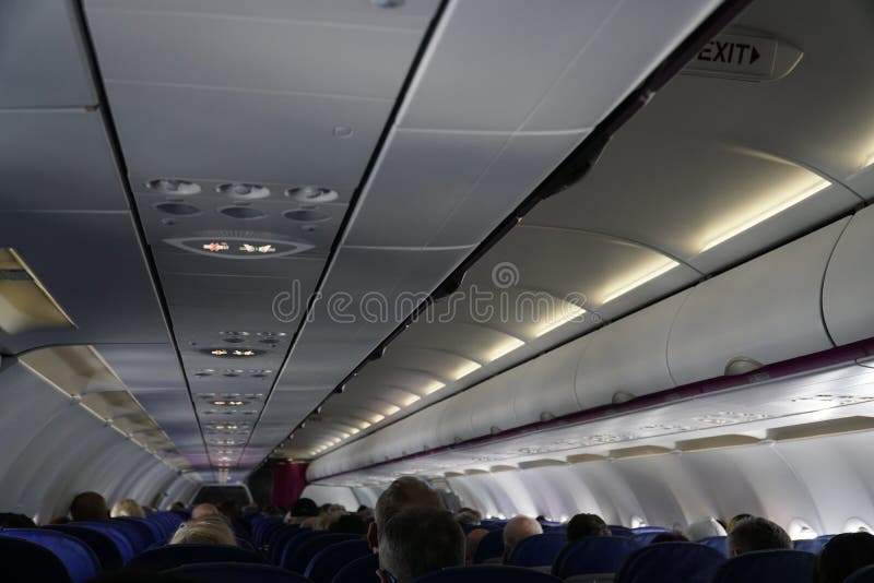 Flying Inside Passenger Airplane Stock Photo - Image of passenger ...