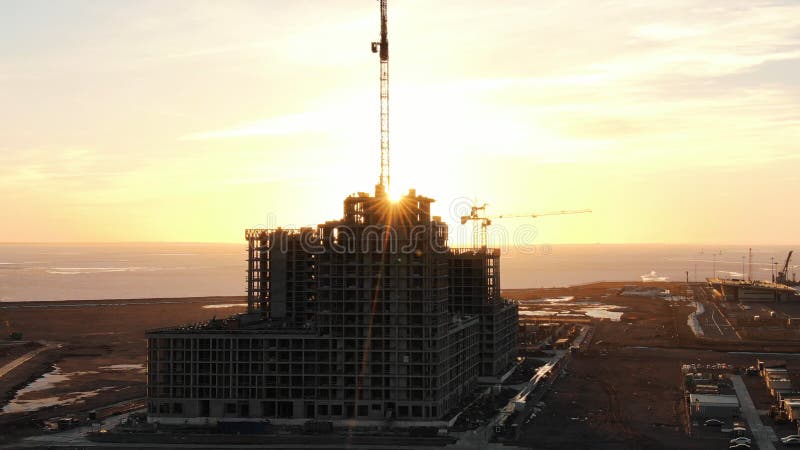 Flying Over the Construction Site, the Work of Construction Cranes and ...