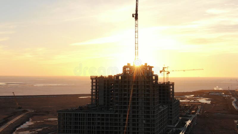 Flying Over the Construction Site, the Work of Construction Cranes and ...