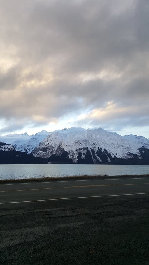 Flying over the mountains stock image. Image of flying - 84612833