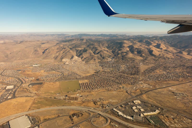 Flying Over Reno Nevada and the Rockies Stock Photo - Image of skyline ...