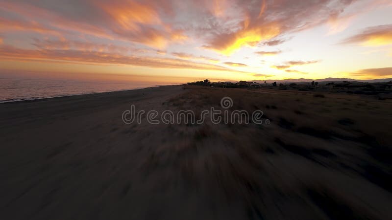 Flying Over a Sandy Coast Lighted by Sunrise Stock Footage - Video of ...
