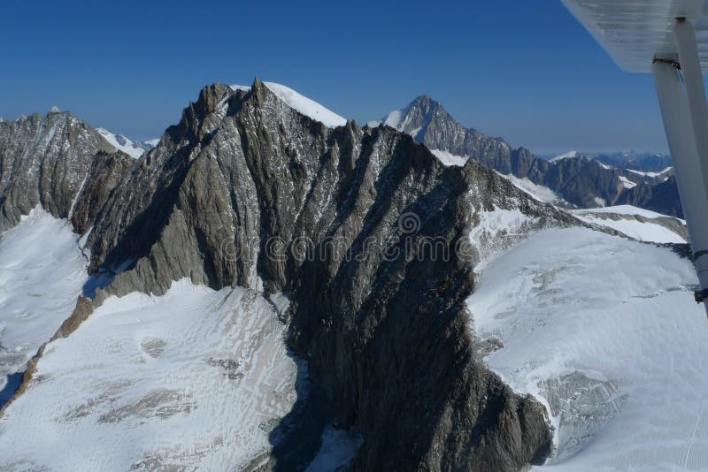 Flying over the Swiss alps stock photo. Image of stone - 11460626