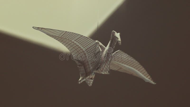 Rotating Paper Origami Crane on a Hanging Wire Stock Video - Video of ...