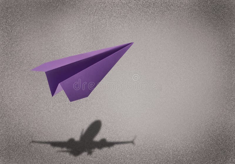 Flying Paper Plane and Shadow of a Real Airplane on Grey Background ...