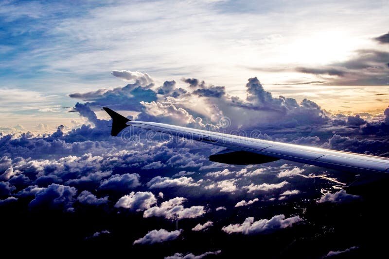Flying Plane Against the Dramatic Blue Sky Stock Image - Image of ...