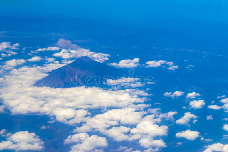 Flying by Plane Over Mexico View of Volcanoes Mountains Clouds Stock ...