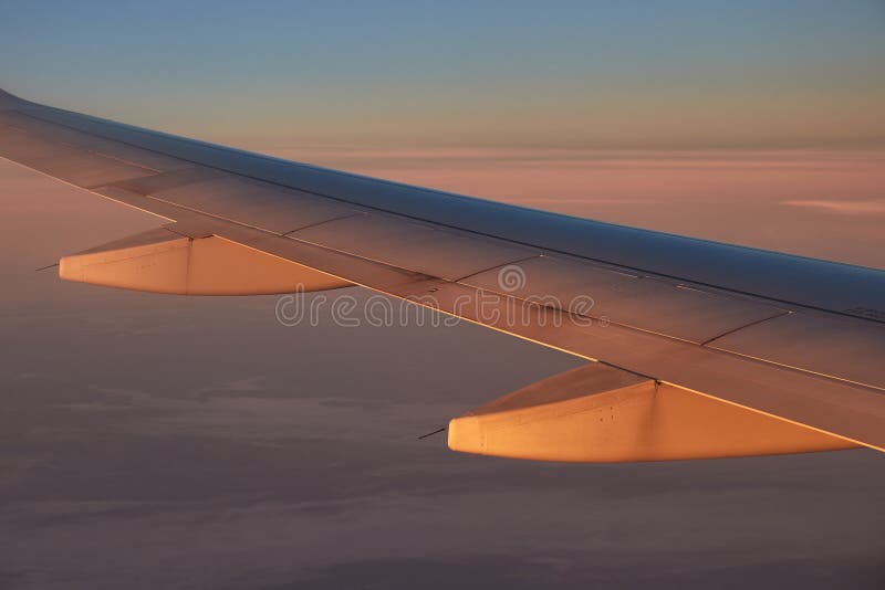 Flying on a Plane, Rising Sun Hitting Wing Stock Photo - Image of high ...