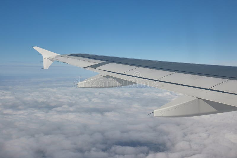 Flying on a plane stock photo. Image of look, midair - 257285676