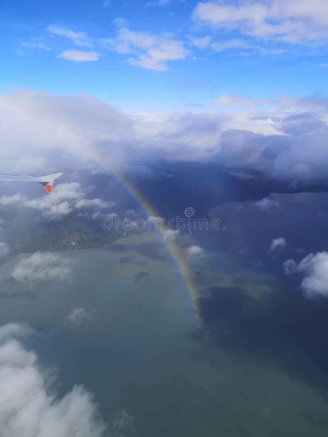 Flying through a rainbow stock image. Image of plain - 248387721