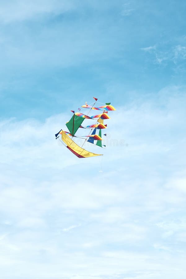 Flying Ship, Rainbow Colored Ship Kite Flies on the Blue Sky and Cloud ...