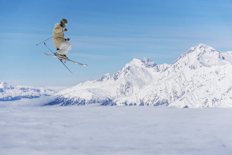 Flying skier on mountains stock photo. Image of relaxation - 49903566