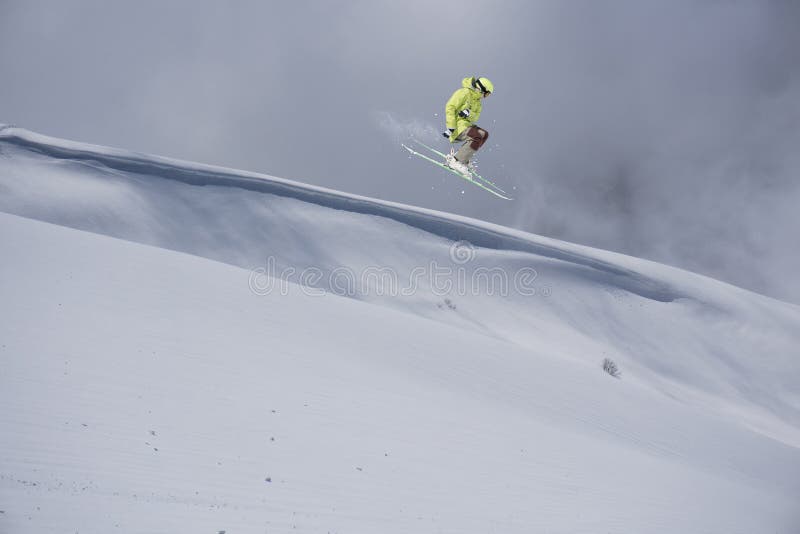 Flying Skier on Mountains. Extreme Sport Editorial Image - Image of ...