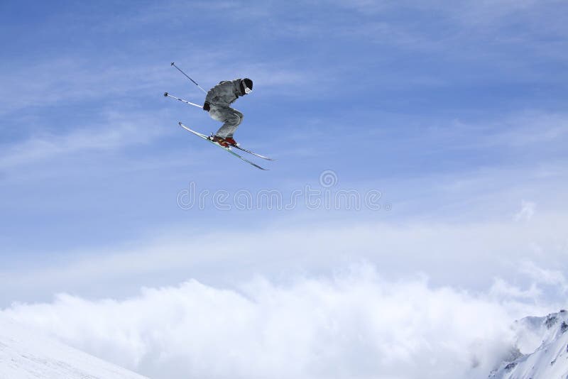 Flying skier on mountains stock image. Image of danger - 36111841