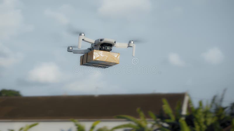 Flying on a Sky Delivery Drone with Holding a .cardboard Parcel Stock ...