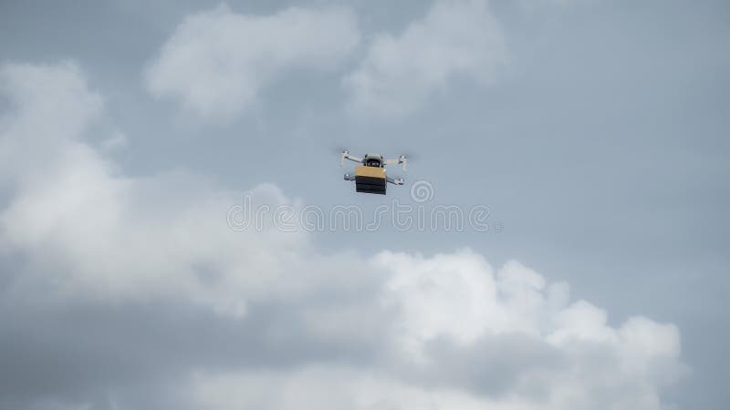 Flying on a Sky Delivery Drone with Holding a .cardboard Parcel Stock ...