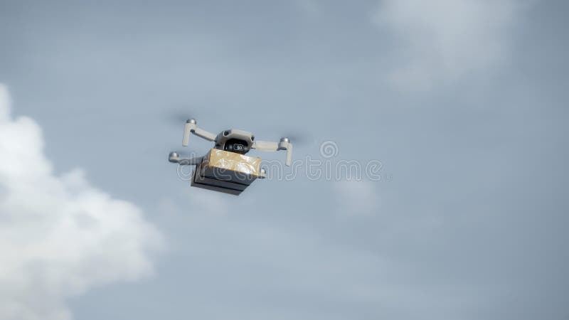 Flying on a Sky Delivery Drone with Holding a .cardboard Parcel Stock ...