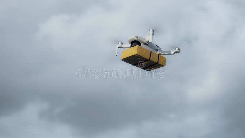 Flying on a Sky Delivery Drone with Holding a .cardboard Parcel Stock ...