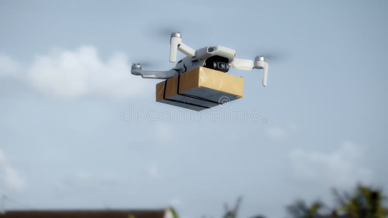 Flying on a Sky Delivery Drone with Holding a .cardboard Parcel Stock ...