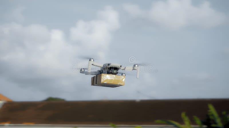 Flying on a Sky Delivery Drone with Holding a .cardboard Parcel Stock ...