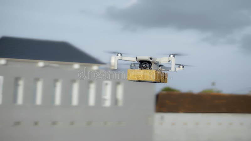 Flying on a Sky Delivery Drone with Holding a .cardboard Parcel Stock ...