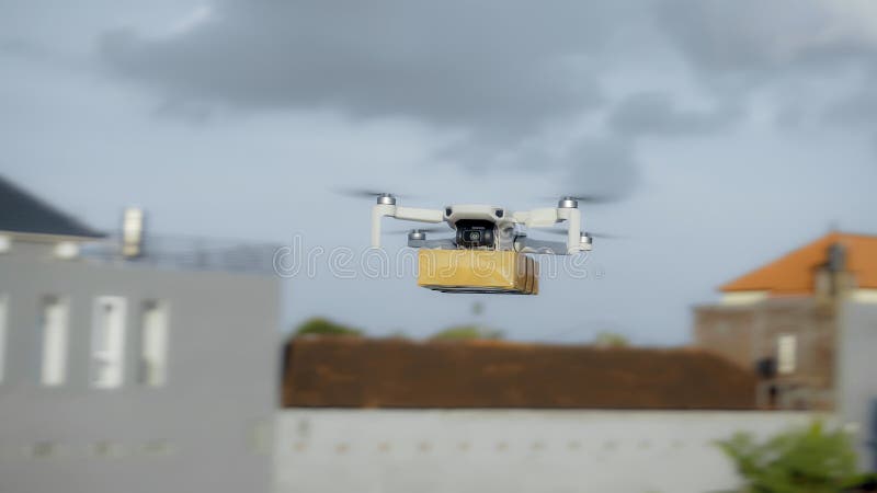 Flying on a Sky Delivery Drone with Holding a .cardboard Parcel Stock ...
