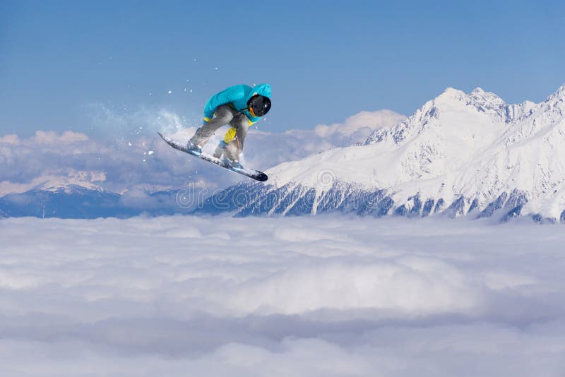 Flying Snowboarder on Mountains Stock Photo - Image of sporting, alps ...