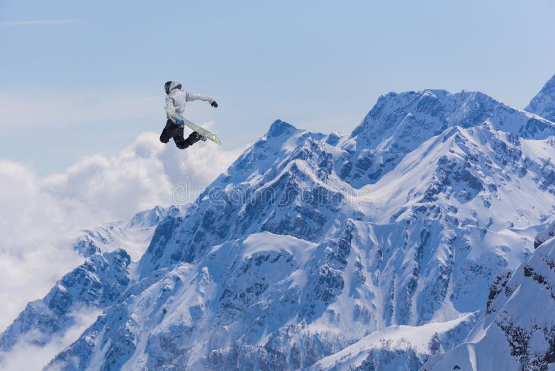 Flying Snowboarder on Mountains, Extreme Sport Stock Image - Image of ...
