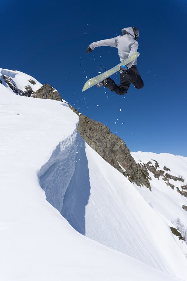 Flying Snowboarder on Mountains. Extreme Sport Editorial Photo - Image ...