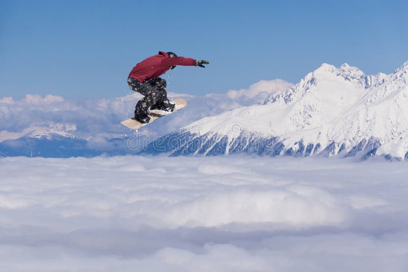 Flying Snowboarder on Mountains. Extreme Sport Editorial Stock Image ...