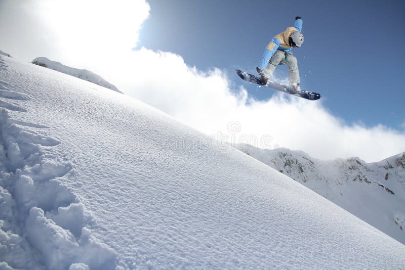 Flying Snowboarder on Mountains. Extreme Sport Stock Photo - Image of ...