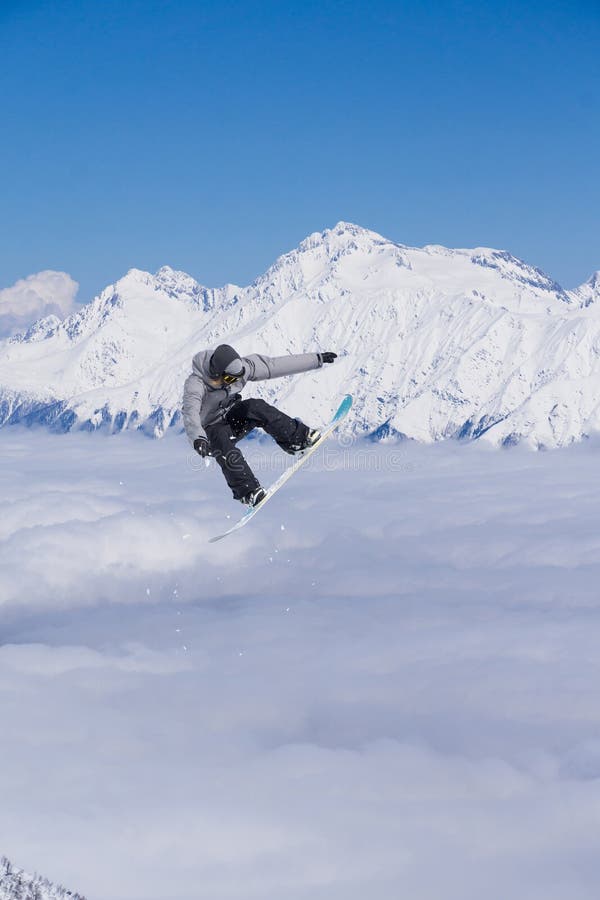 Flying Snowboarder on Mountains. Extreme Sport Stock Image - Image of ...