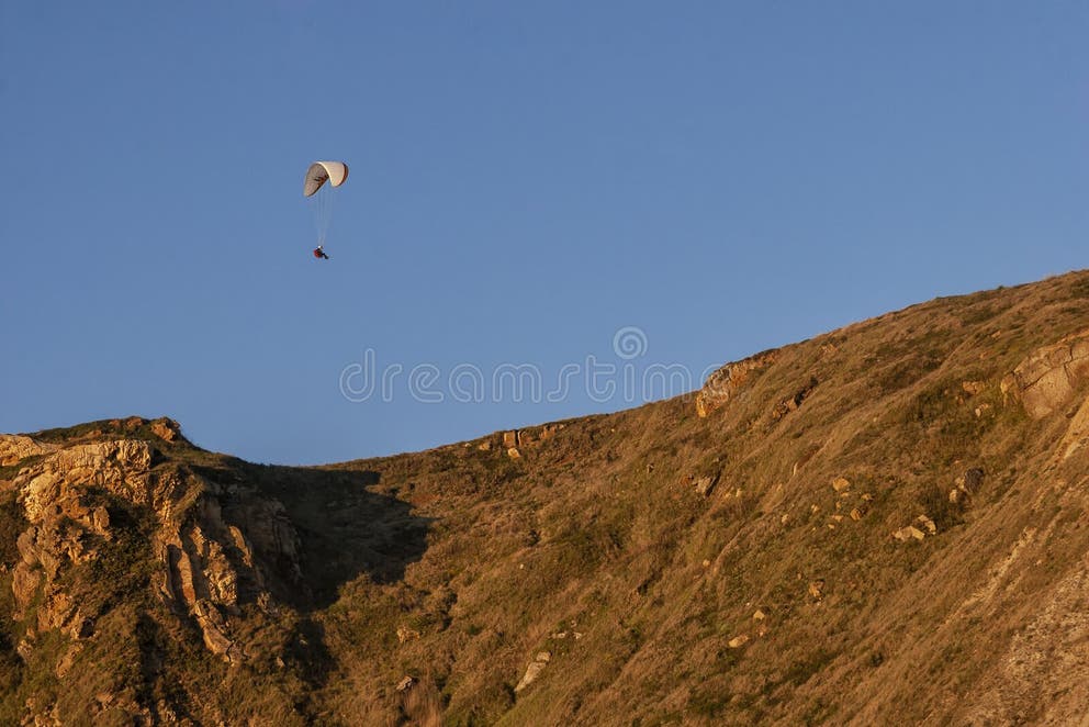Flying with a Paraglider at Sunset Stock Photo - Image of paraglider ...