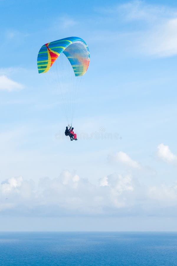 Flying Tandem Paraglider Over the Sea, Vertical Shot Stock Image ...