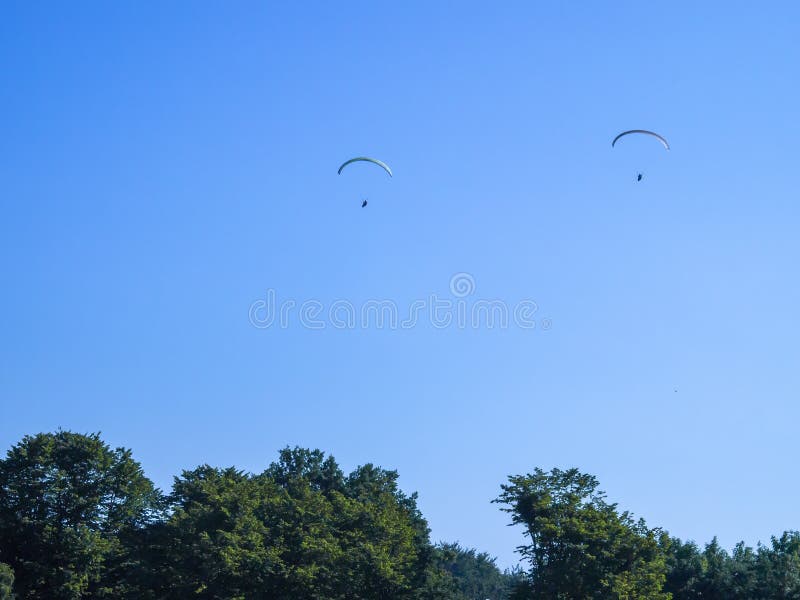 Flying Together with Wind Parachutes Stock Photo - Image of flight ...