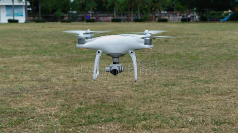 The flying white drone stock photo. Image of quadcopter - 84074220