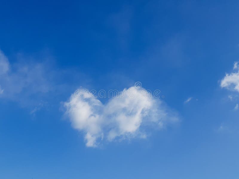 Flying White Heart-shaped Clouds Over the Blue Sky Stock Photo - Image ...