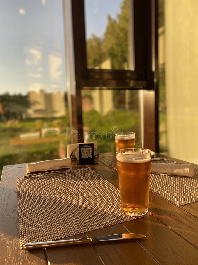 Foam Beer Shimmering in the Rays of Window Light Stock Photo - Image of ...