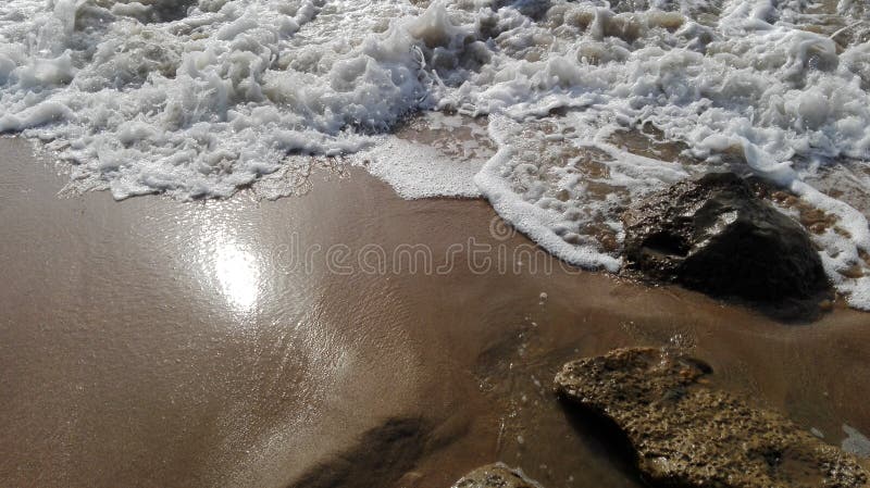 Foam formed by sea wave stock photo. Image of white - 138985200