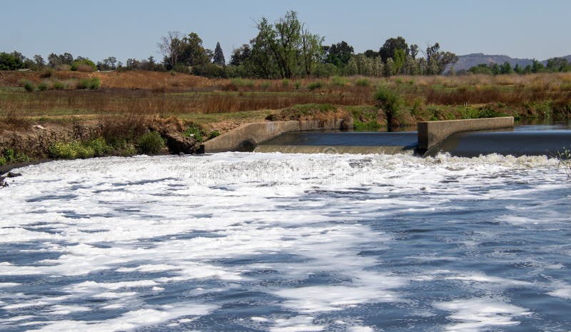 Below a weir in a river stock photo. Image of landscape - 338794846