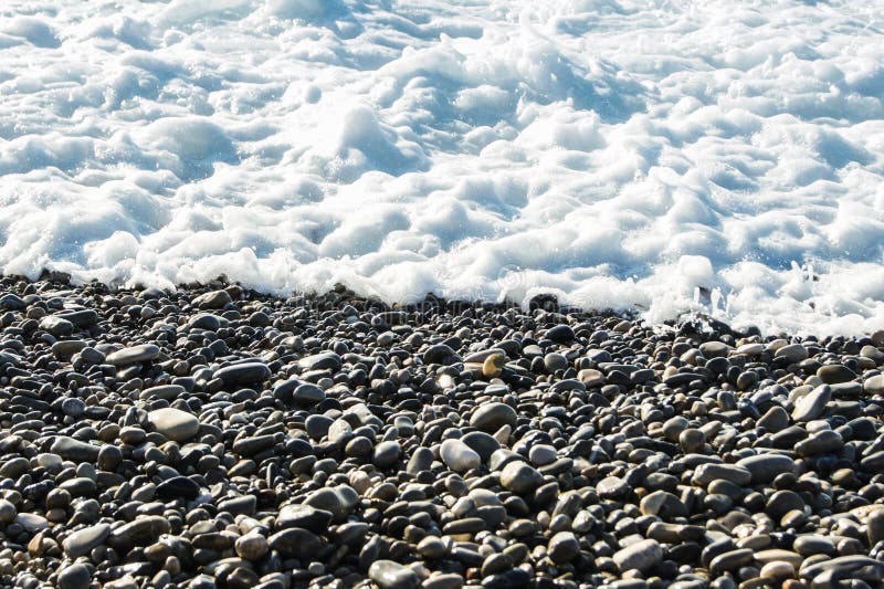Foam on pebbles. stock image. Image of landscape, wave - 89052857
