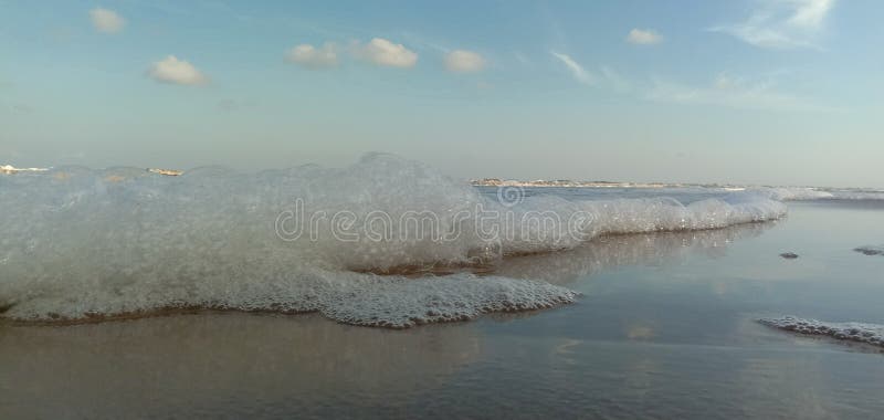 Foam waves on the beach stock image. Image of waves - 221384049