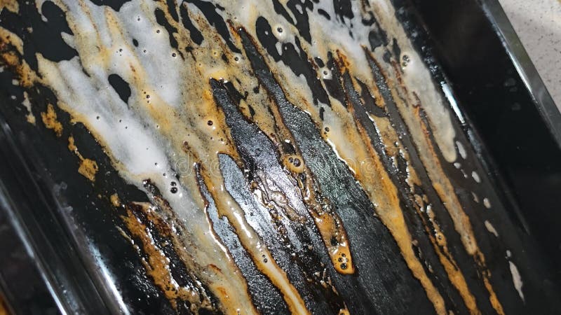 Foaming Detergent Dissolves Grease on Dirty Baking Pan Stock Footage ...