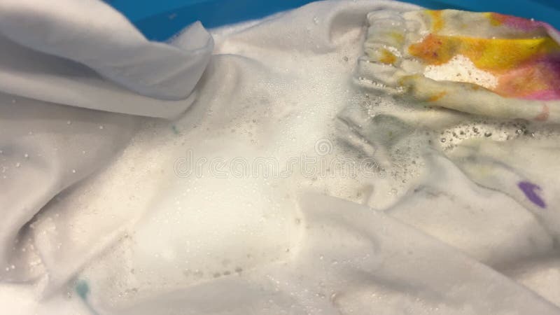 Foaming Detergent Reacting with Water on Stained Clothes in Laundry Tub ...