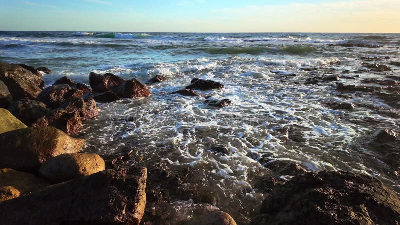 Foamy Seaside Waves Crash Against the Rocky Shore Stock Video - Video ...