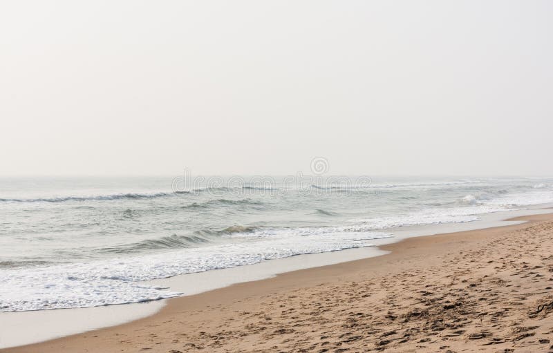Foamy water on calm beach stock image. Image of seascape - 124320971