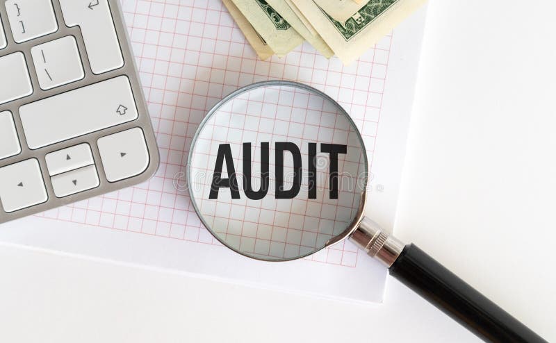 Focus on Audit with Magnifying Glass on the Office Desk. Stock Photo ...