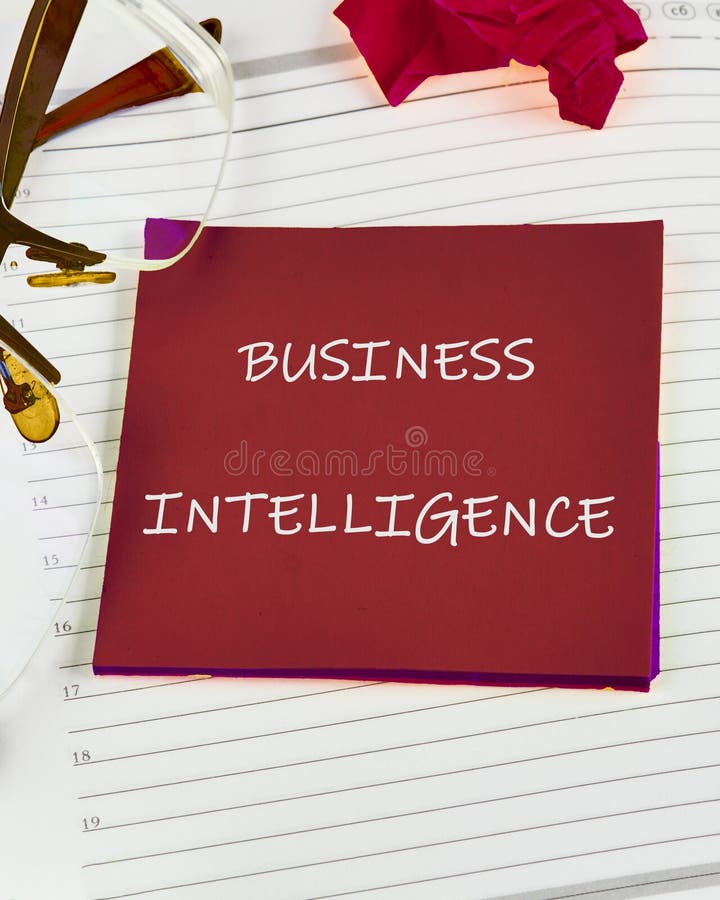 Focus on Business Intelligence with Notes and Tools Displayed on a Work ...
